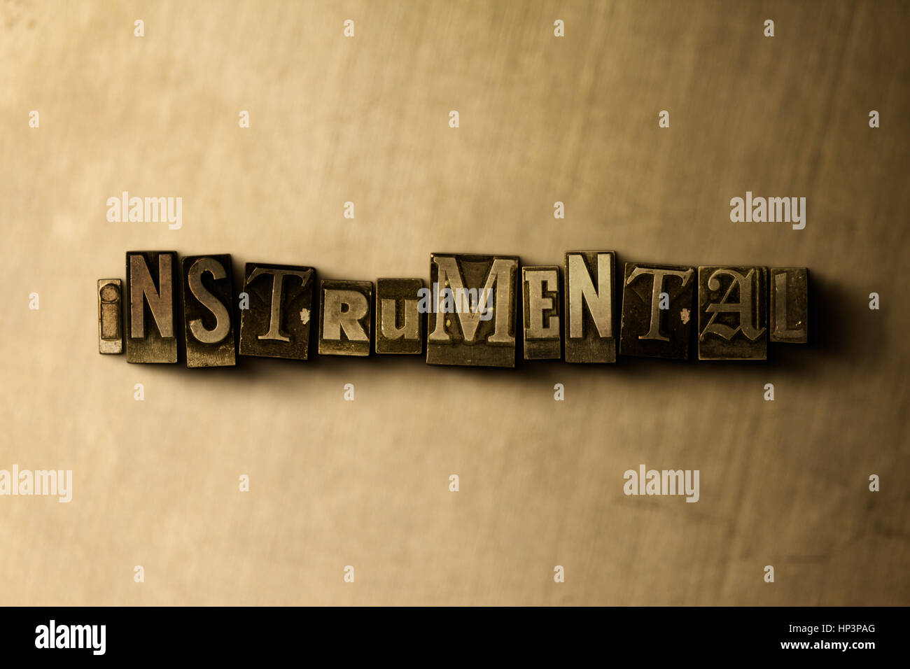 INSTRUMENTAL - close-up of grungy vintage typeset word on metal ...