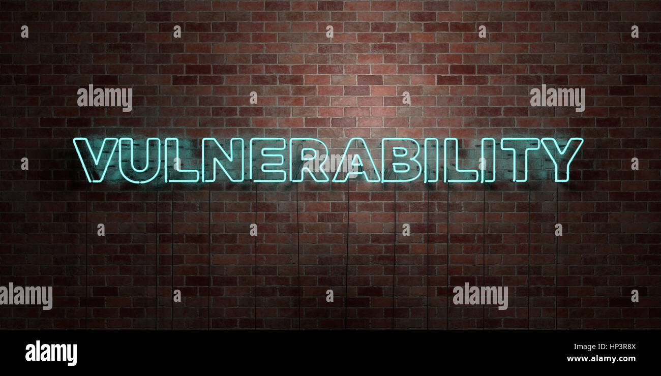 VULNERABILITY - fluorescent Neon tube Sign on brickwork - Front view ...