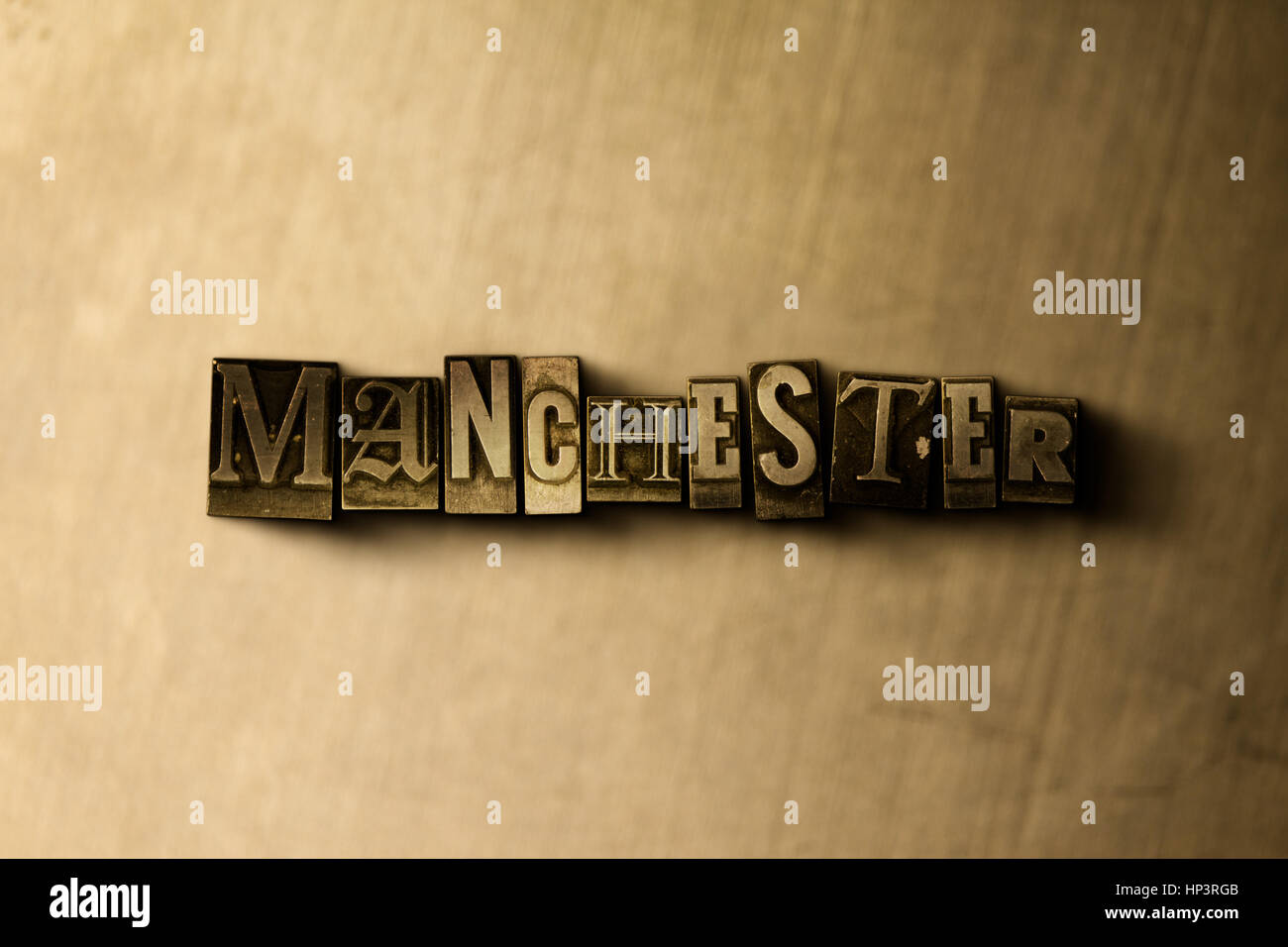 MANCHESTER - close-up of grungy vintage typeset word on metal backdrop ...