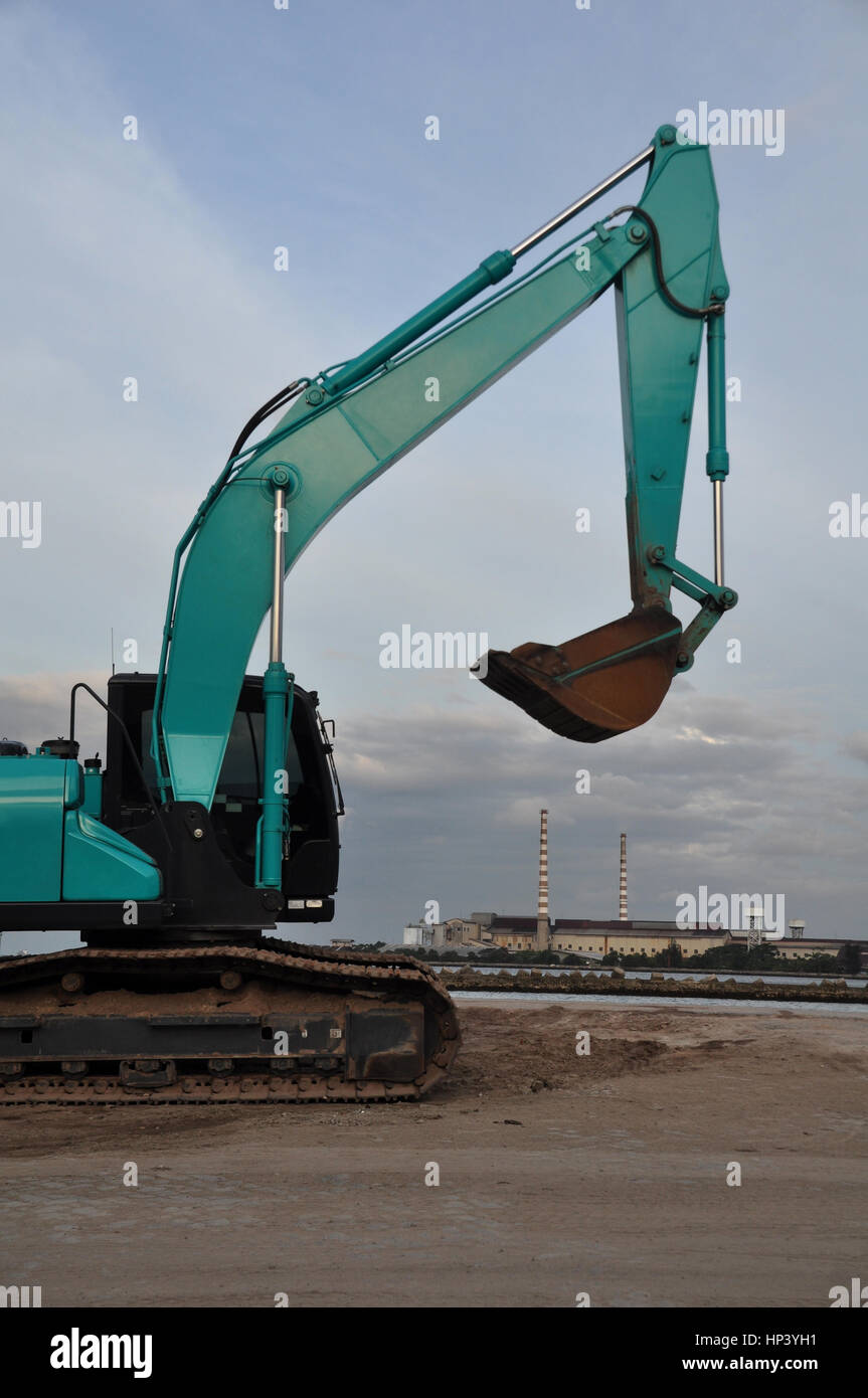 Green excavator hi-res stock photography and images - Alamy