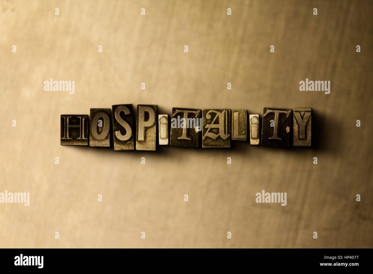 HOSPITALITY - close-up of grungy vintage typeset word on metal backdrop ...