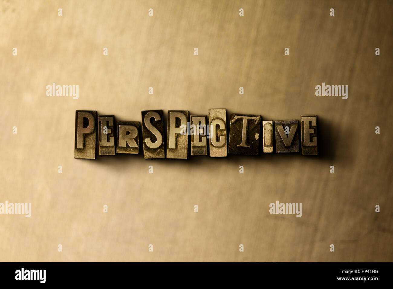PERSPECTIVE - close-up of grungy vintage typeset word on metal backdrop ...