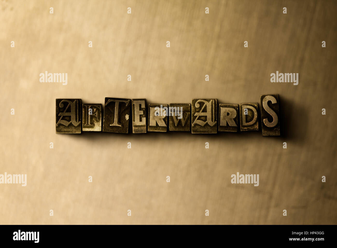 AFTERWARDS - close-up of grungy vintage typeset word on metal backdrop ...