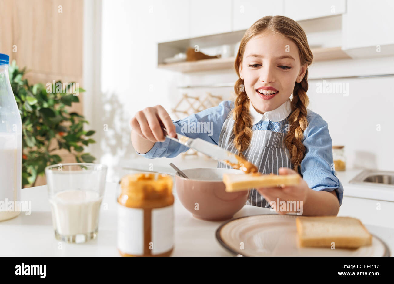 Gorgeous young lady making herself breakfast Stock Photo - Alamy