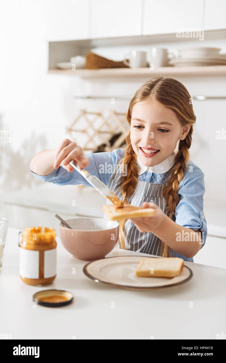 Admirable charming girl cooking nutritious breakfast Stock Photo - Alamy