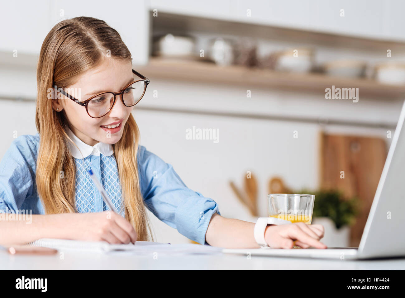 Diligent pretty student searching for some useful tips online Stock ...