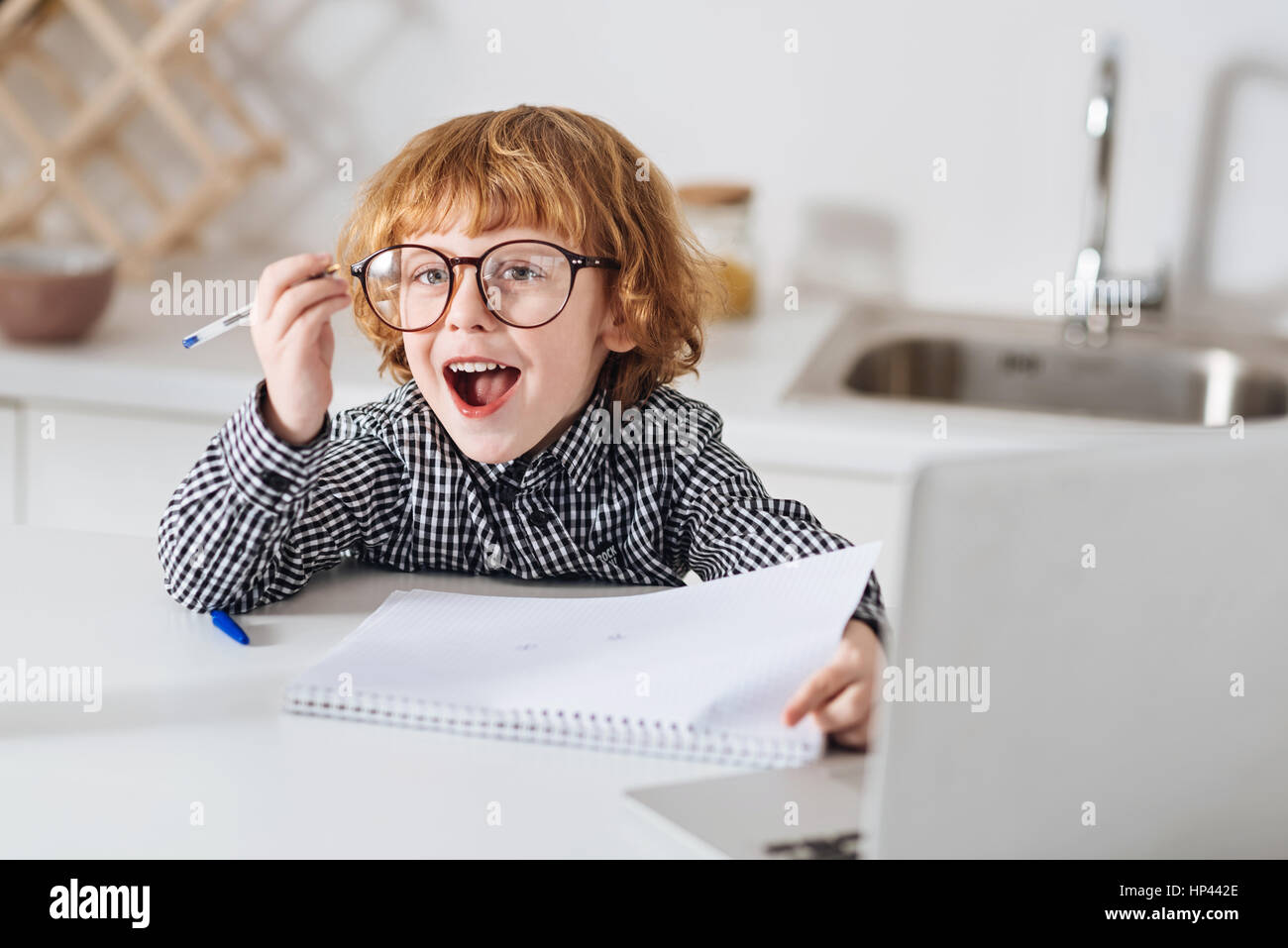 Enthusiastic smart kid working on his handwriting Stock Photo - Alamy