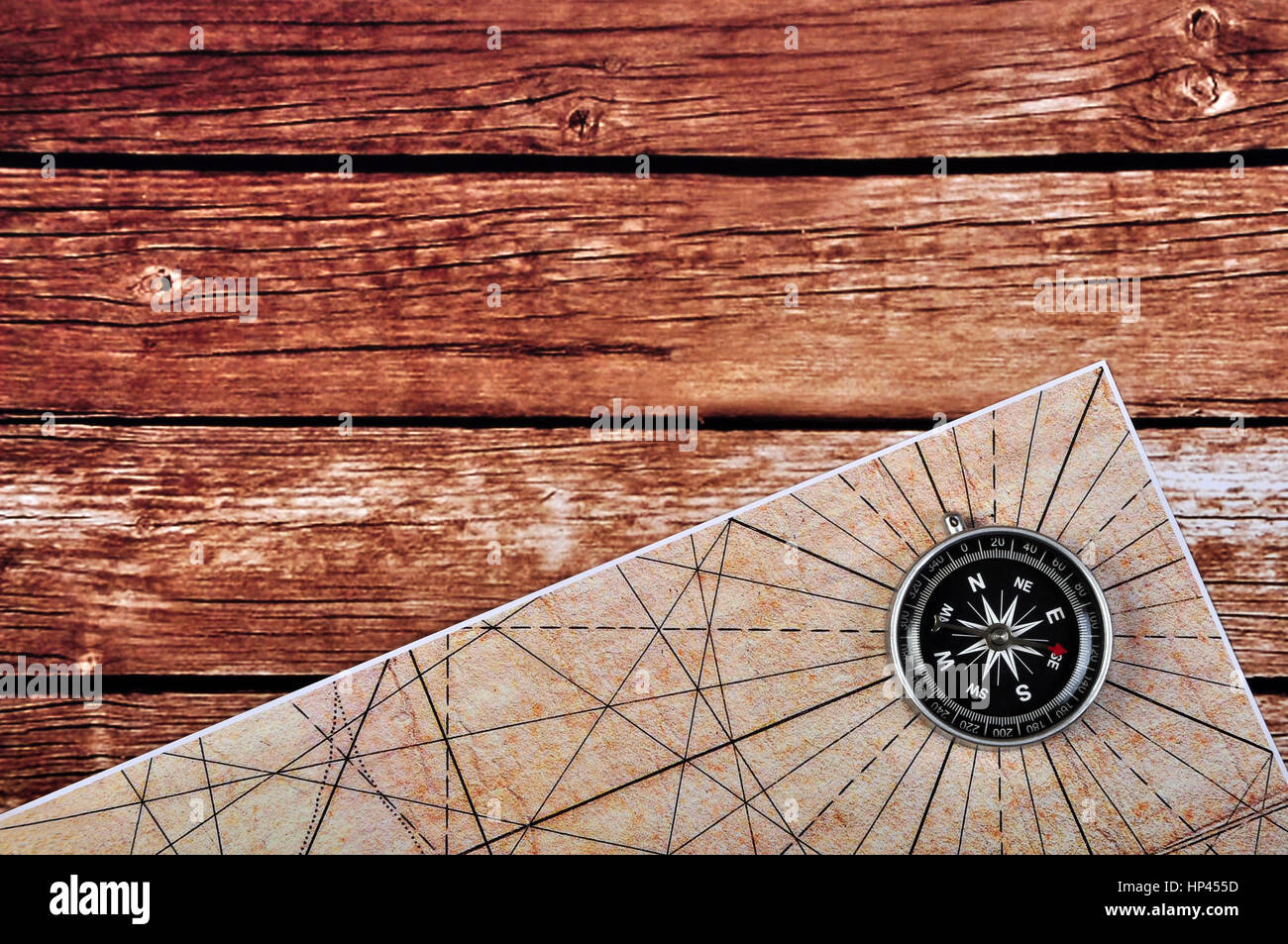 Compass on maps horizontal Stock Photo - Alamy