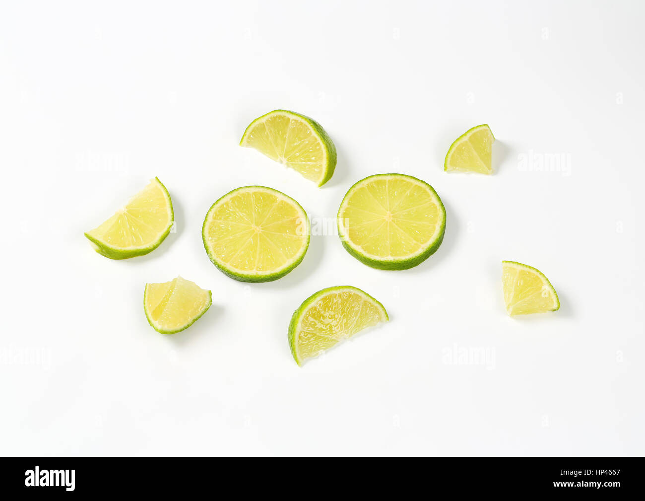 small pieces of fresh lime on white background Stock Photo - Alamy
