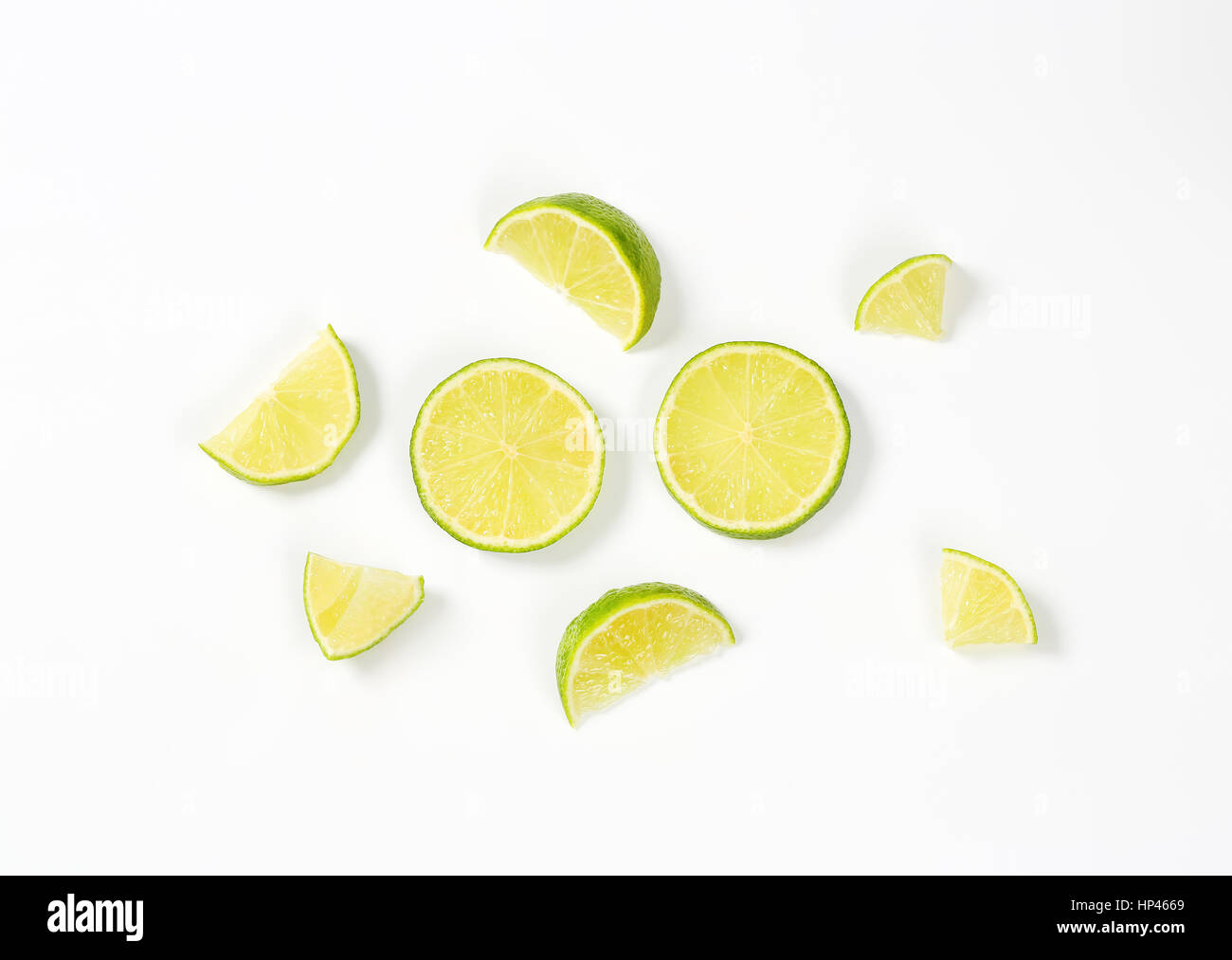 small pieces of fresh lime on white background Stock Photo - Alamy