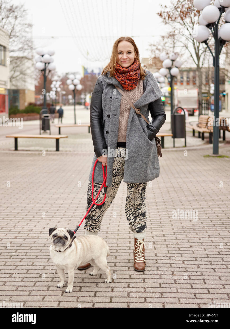 Woman holding pet pug hi-res stock photography and images - Alamy