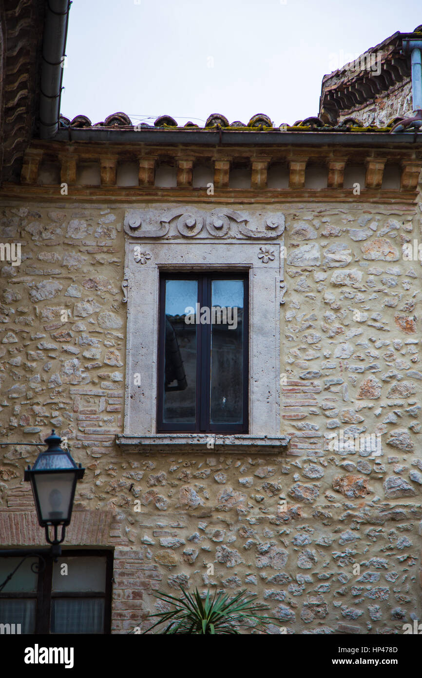 Window on a stone wall with a marble frame Stock Photo - Alamy
