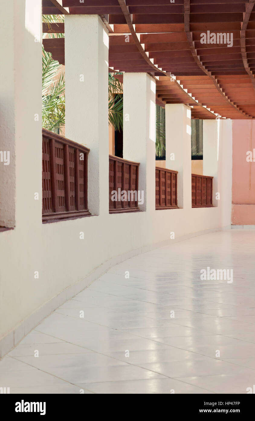 long gallery corridor with columns in perspective Stock Photo - Alamy