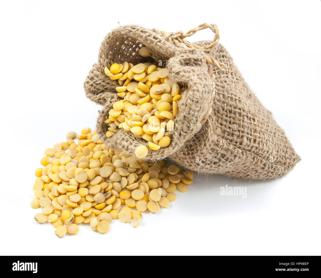 Dried soybean in canvas sack on white background Stock Photo - Alamy