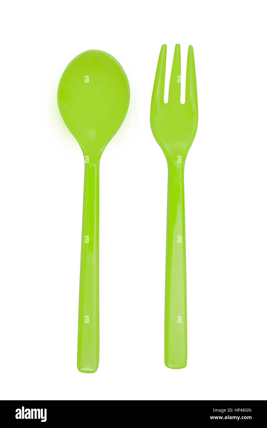 Green plastic fork and spoon isolated on white Stock Photo - Alamy