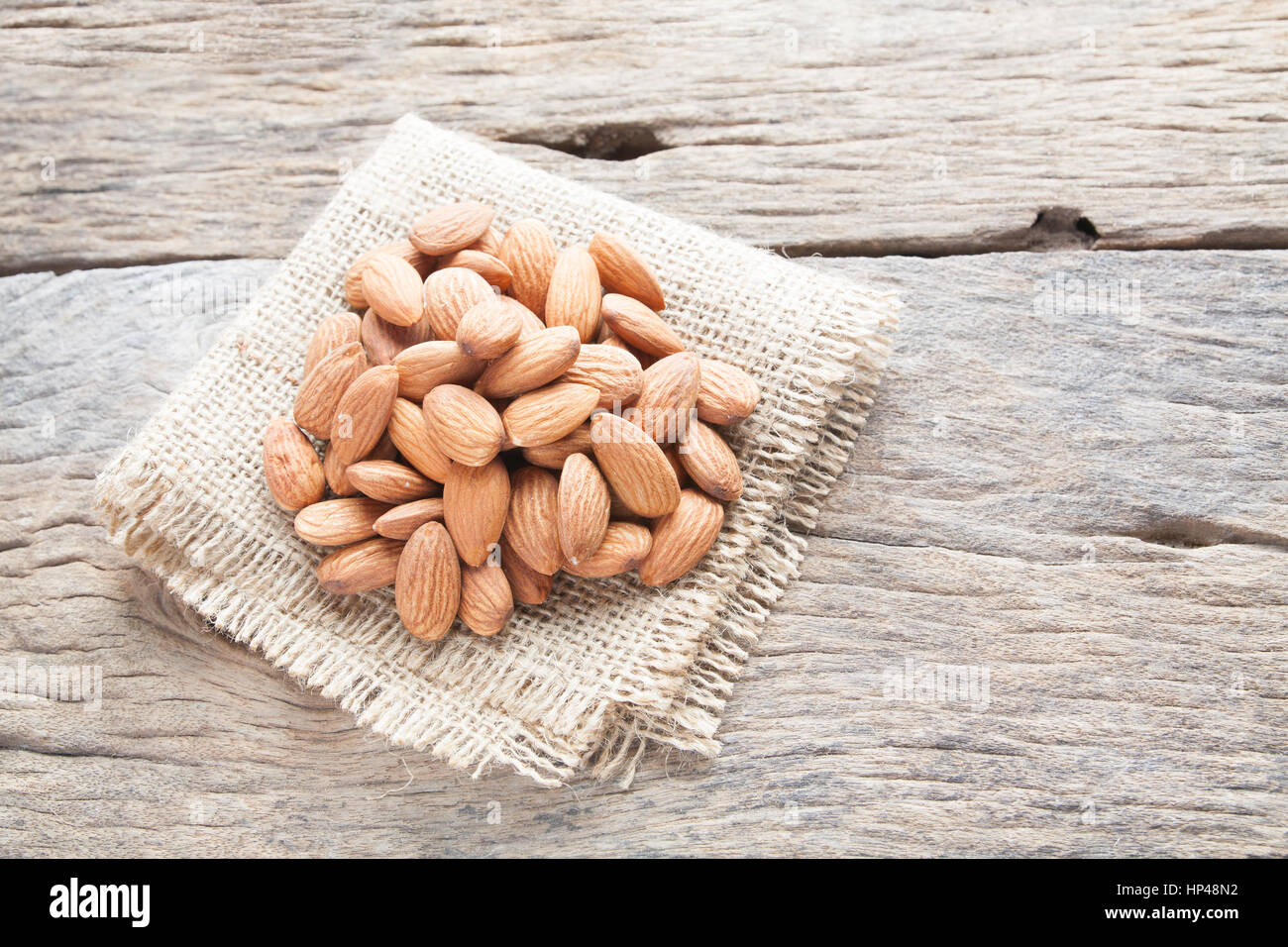 group of almonds on sack background Stock Photo - Alamy