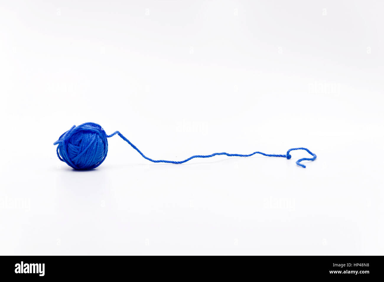 hank blue wool threads isolated on white background Stock Photo - Alamy