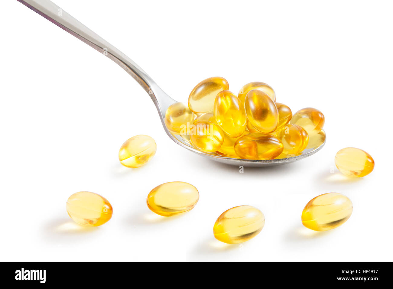 Omega-3 pills on spoon. , file includes a excellent clipping path Stock ...
