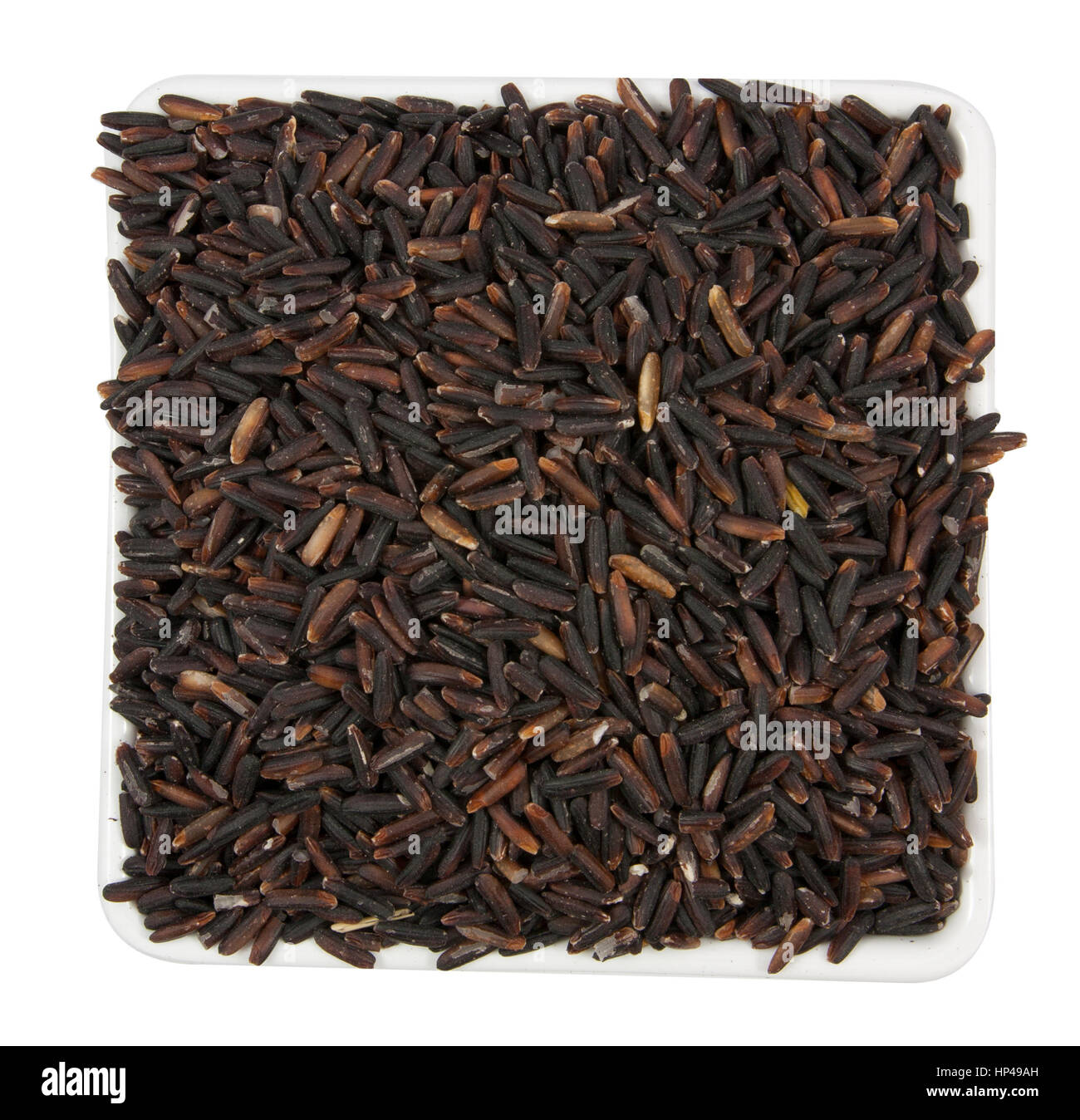 Black rice on cup isolated on a white background Stock Photo - Alamy