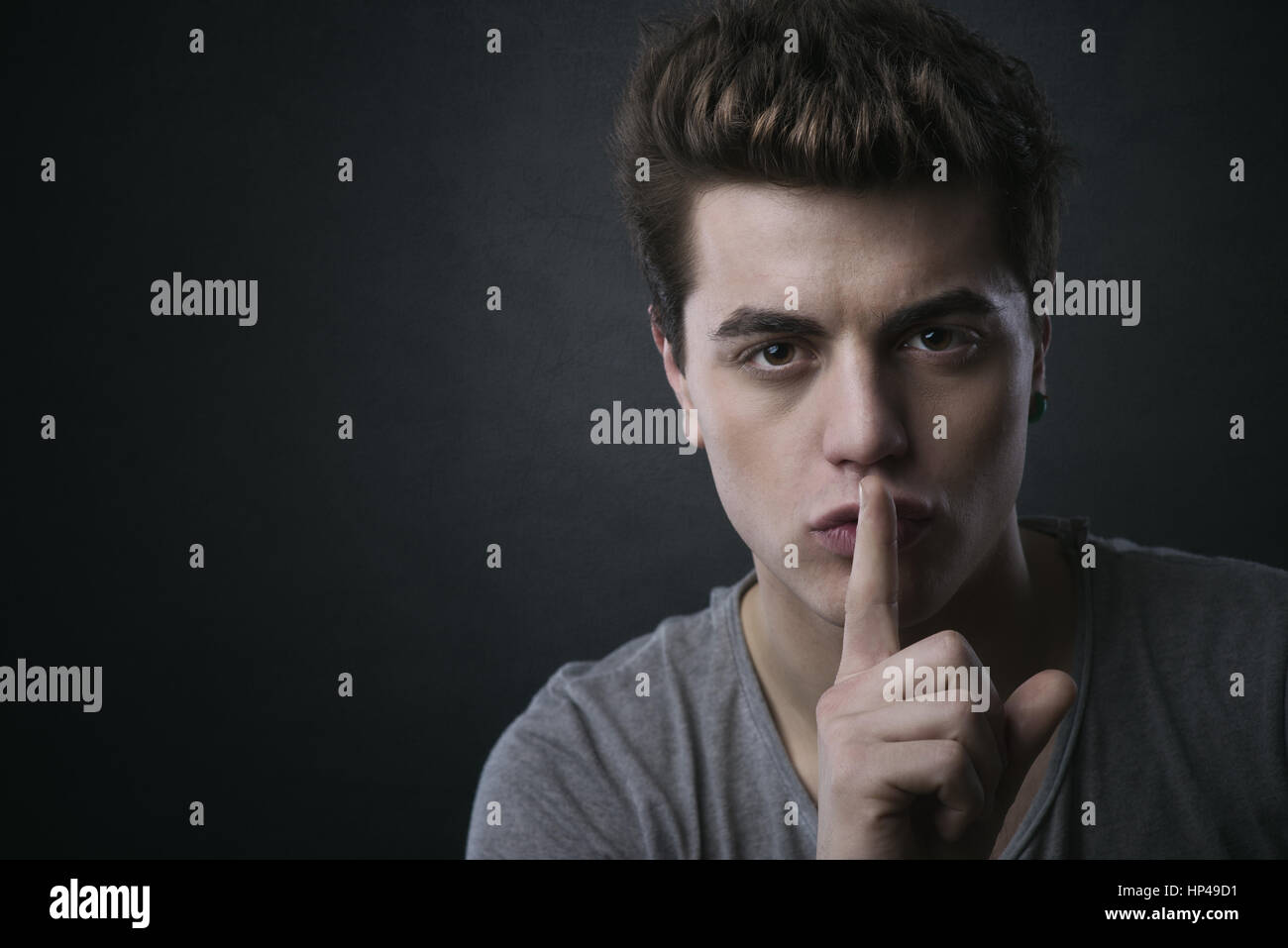 Teenager boy gesture shh hi-res stock photography and images - Alamy
