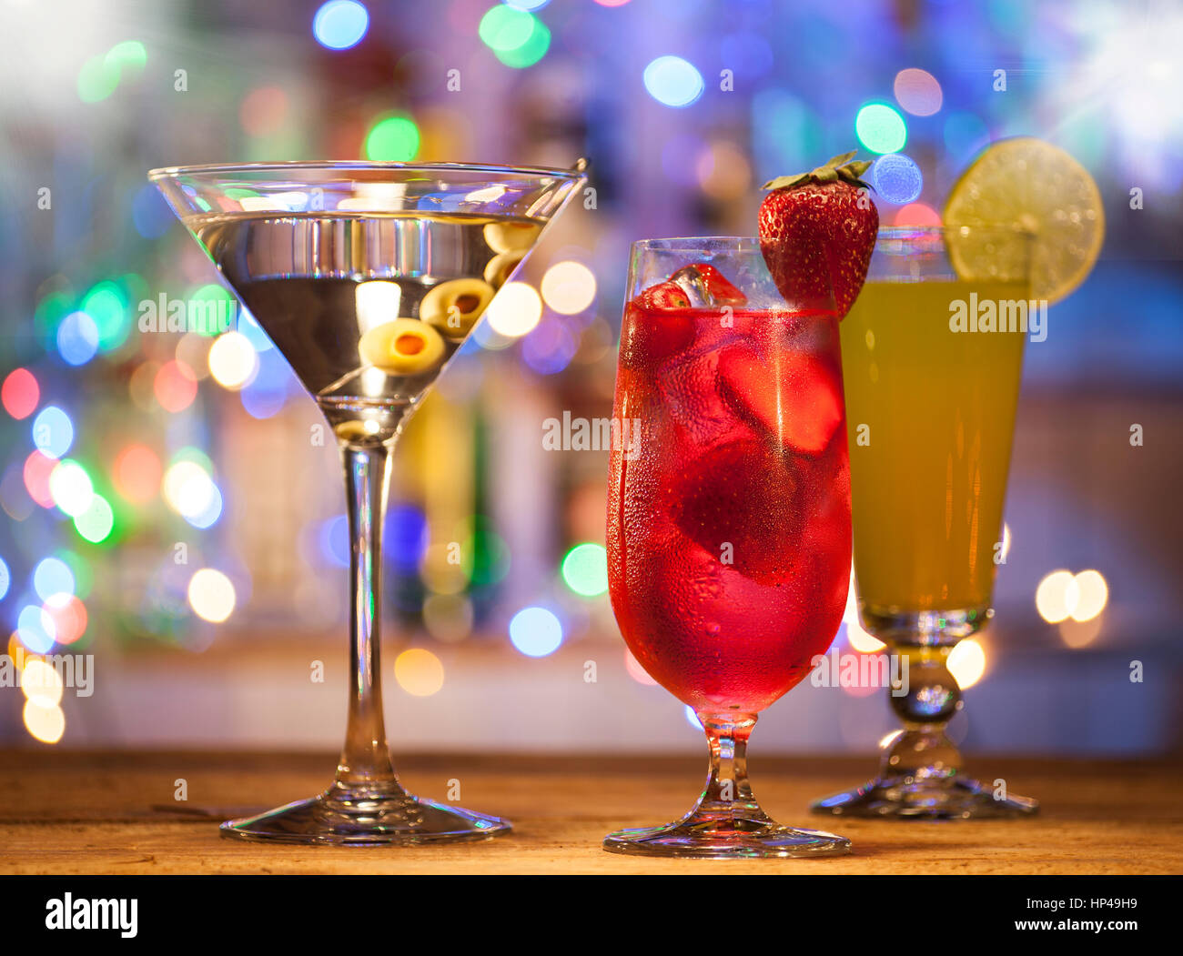 Set with different cocktails on a bar lights background Stock Photo - Alamy