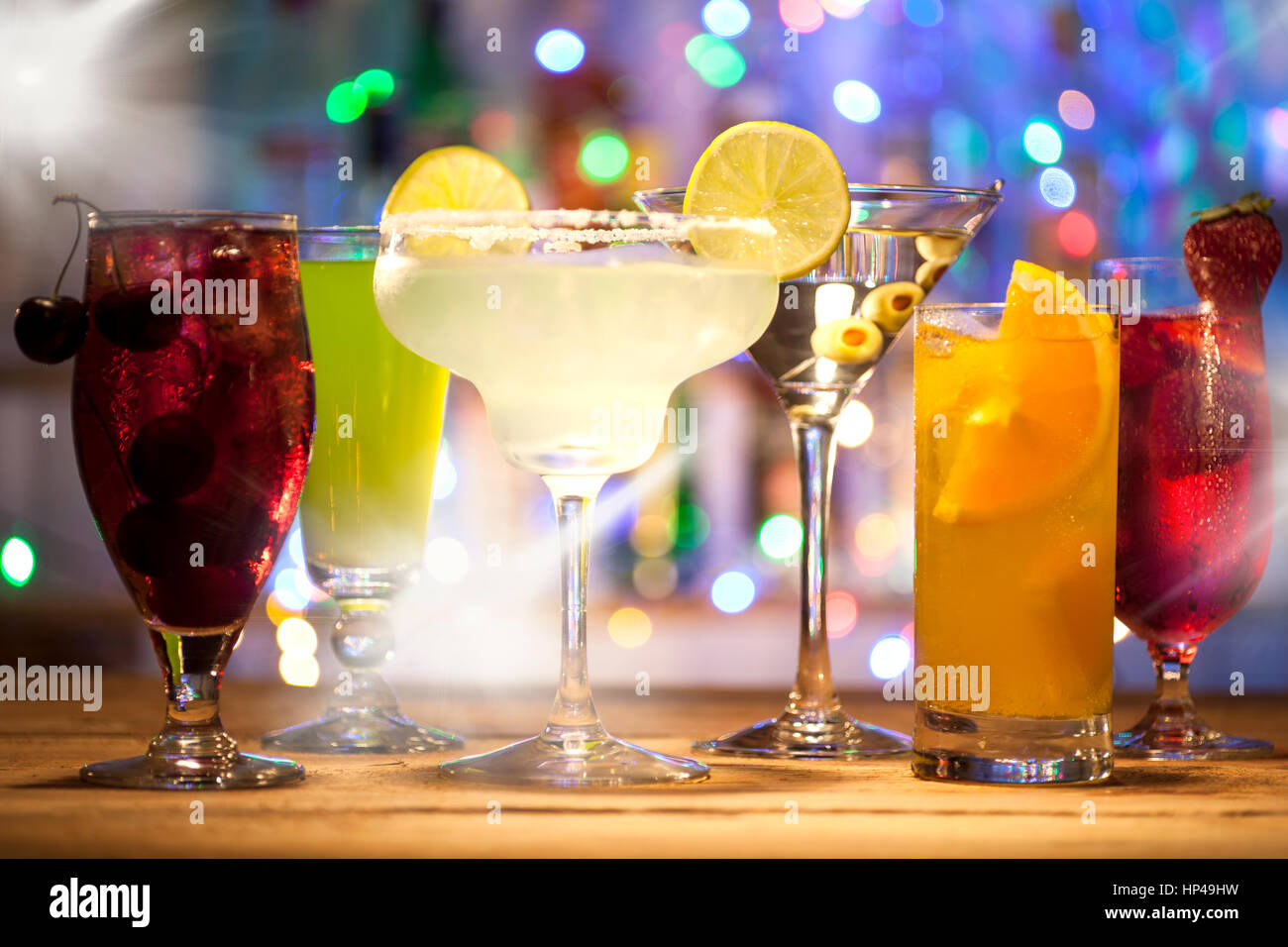 Set with different cocktails on a bar lights background Stock Photo - Alamy