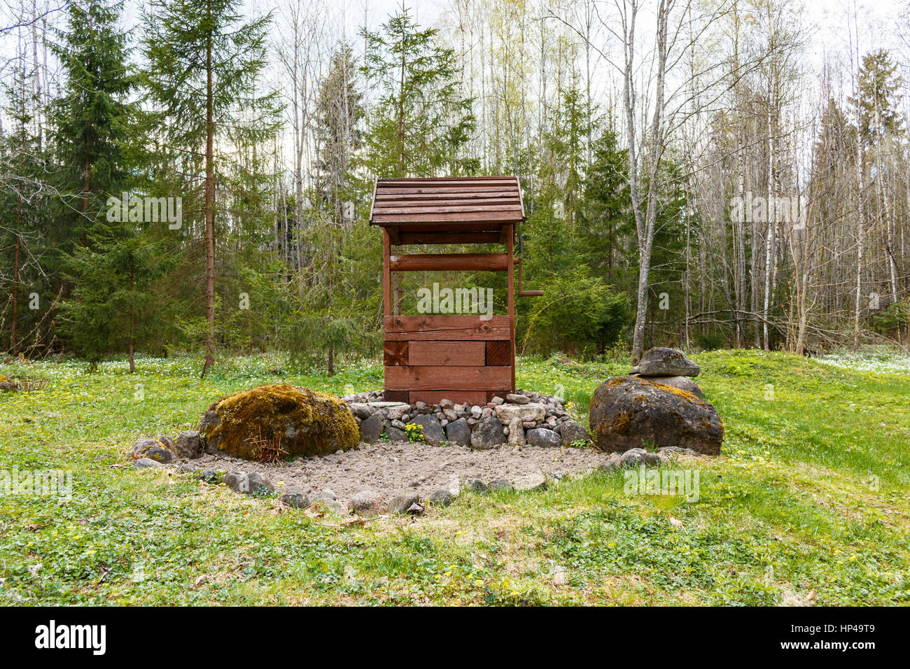 a Wooden well in the woods. spring Stock Photo - Alamy