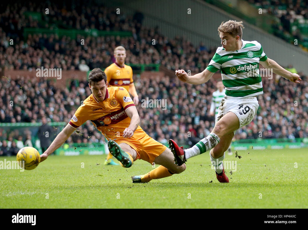 Celtic's James Forrest and Motherwell's Ben Heneghan battle for the ...