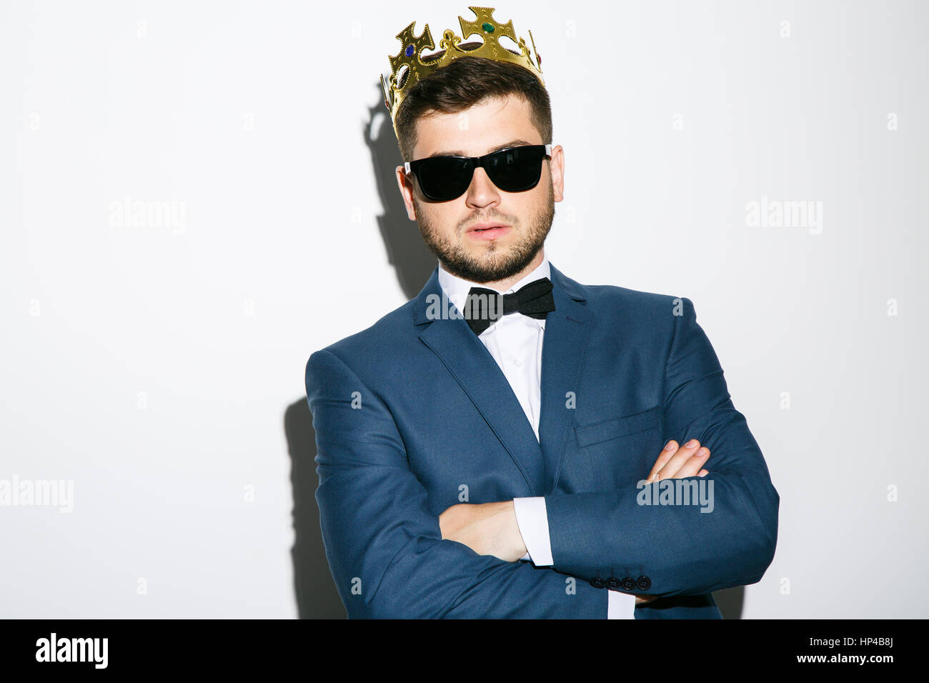 Serious young man with crown Stock Photo - Alamy