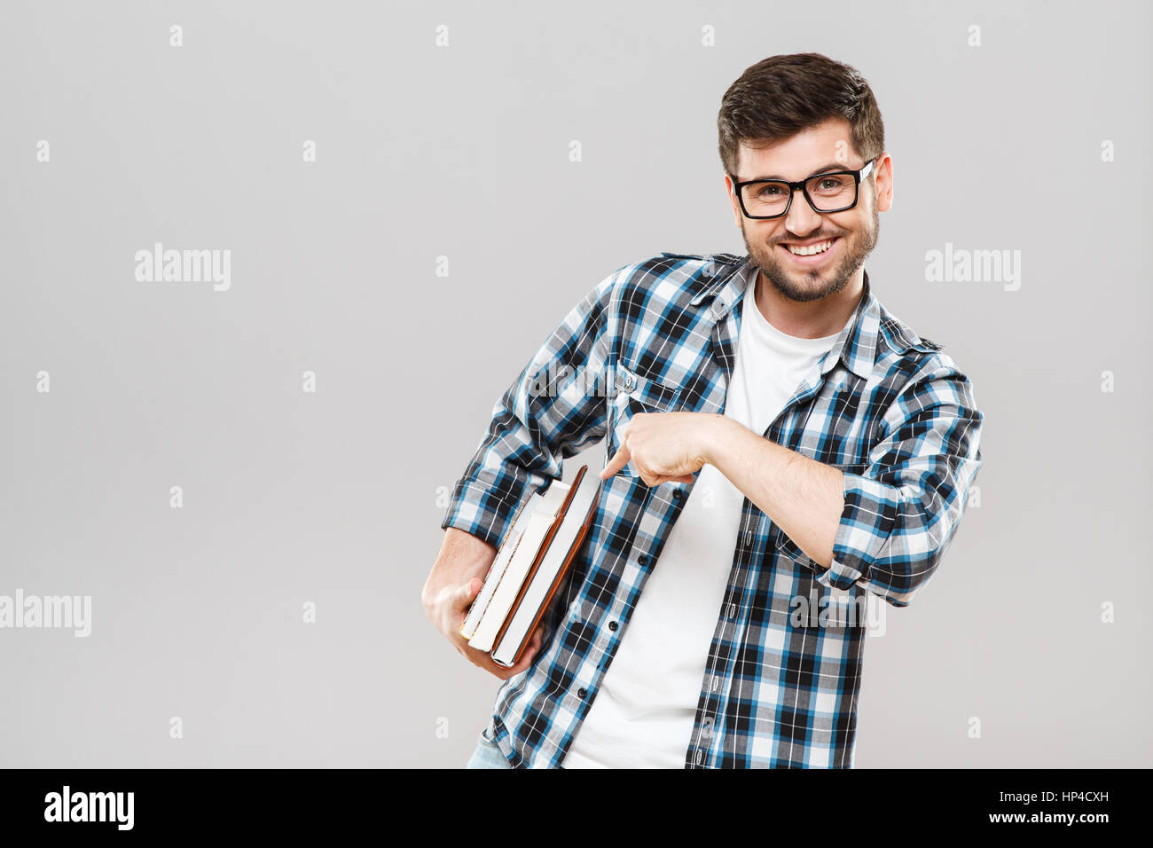 Man pointing at books Stock Photo - Alamy