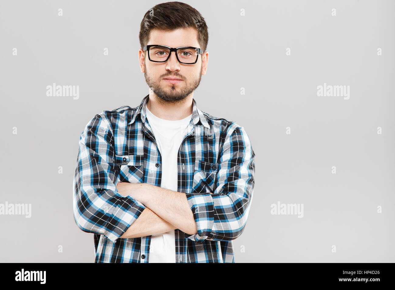 Man with crossed hands Stock Photo - Alamy