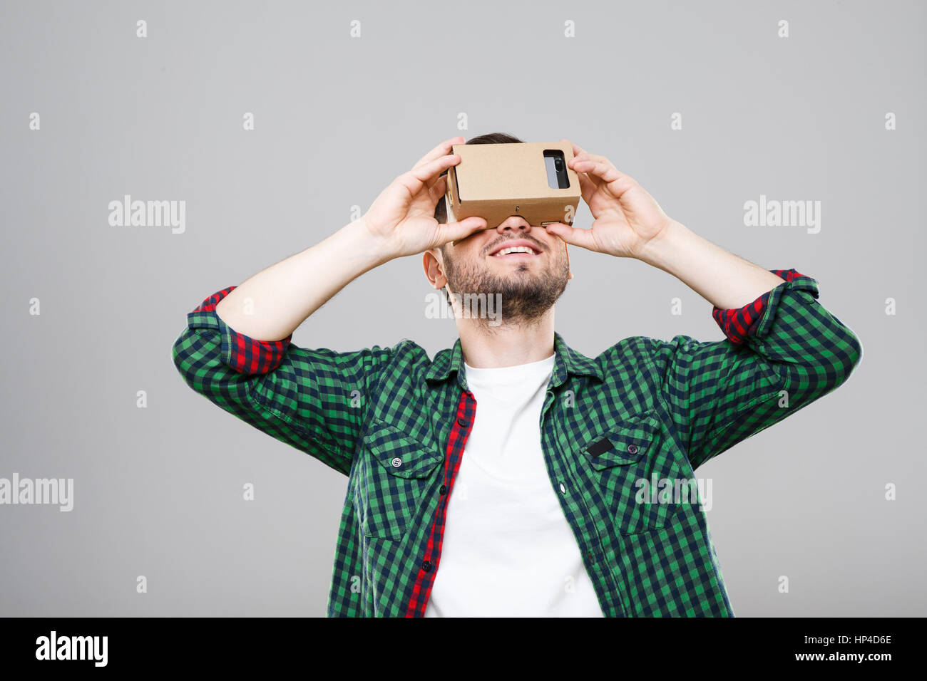 Man looking at vr box Stock Photo - Alamy