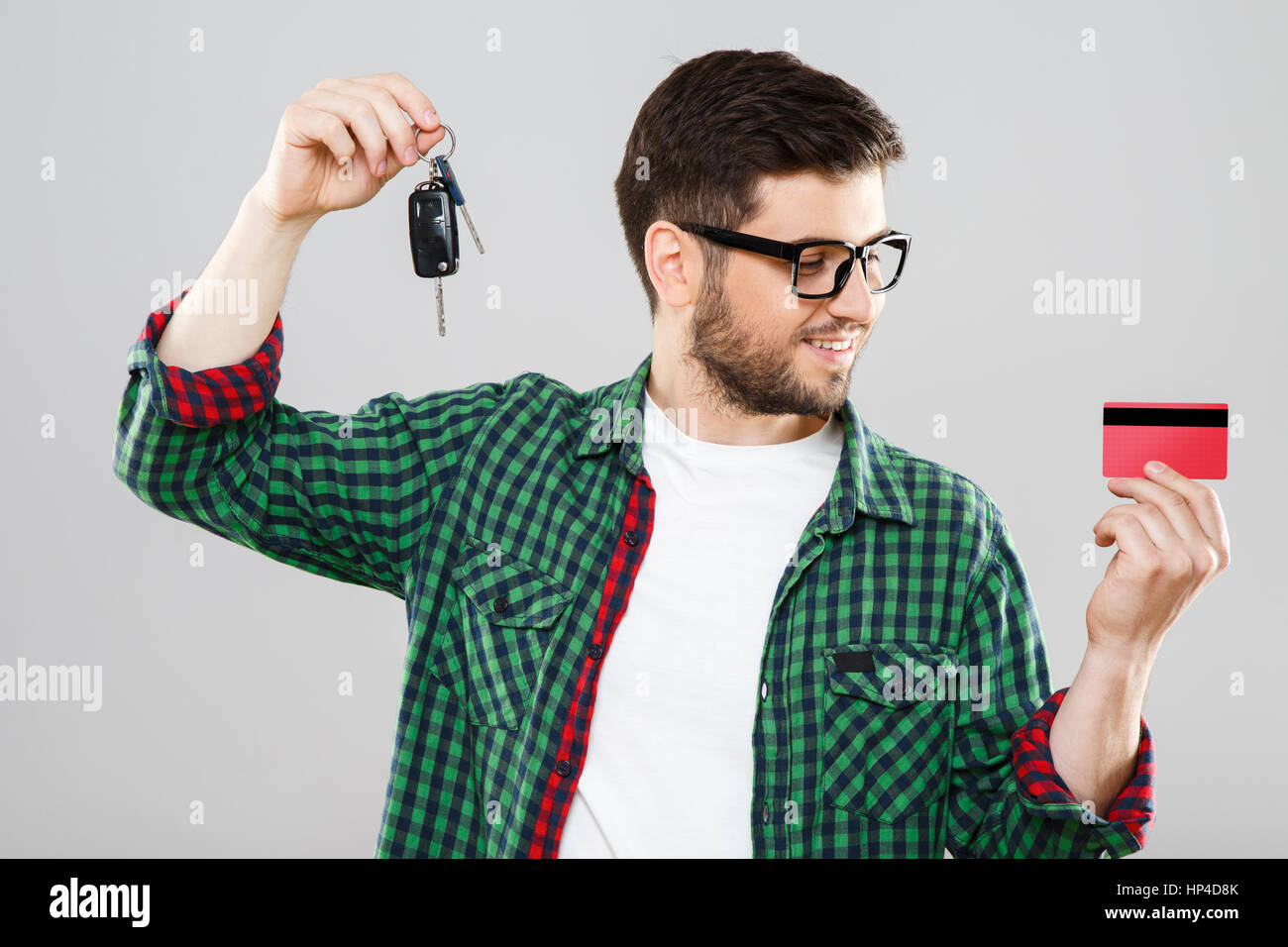 Man holding car keys and credit card Stock Photo - Alamy