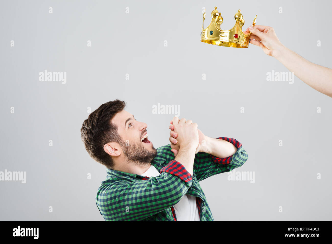 Surprised man with crown above his head Stock Photo - Alamy