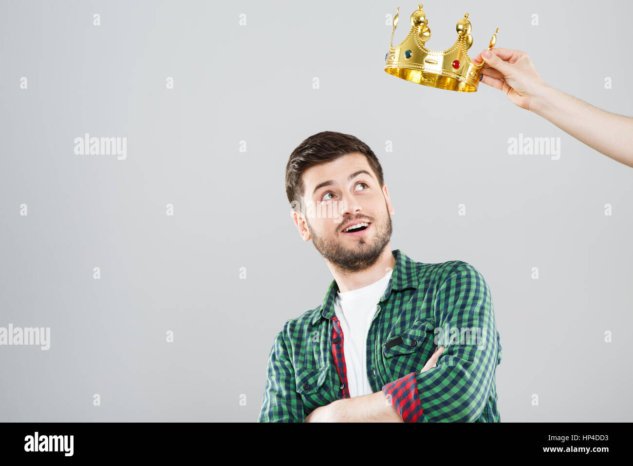 Young man with crown above his head Stock Photo - Alamy