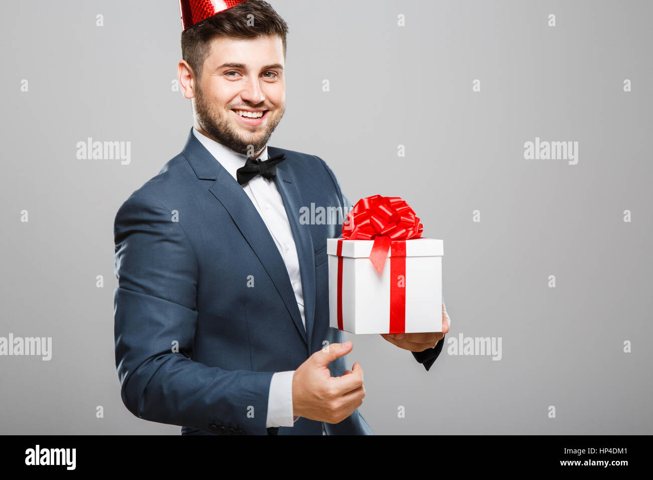 Man holding present Stock Photo - Alamy