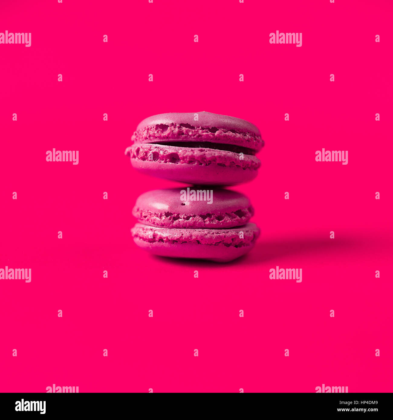 pink macaron on colorful background Stock Photo - Alamy
