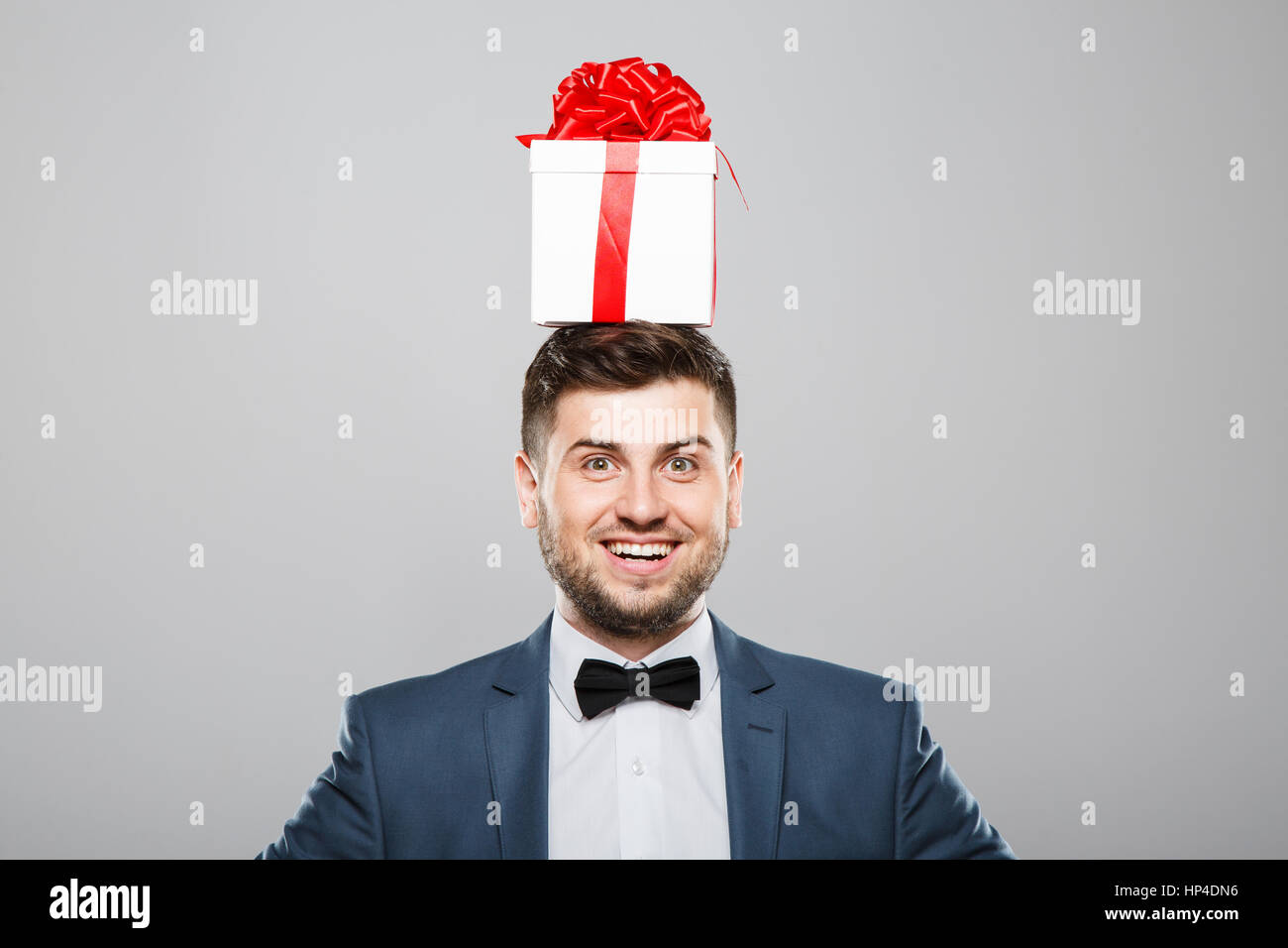 Man with birthday present on head Stock Photo - Alamy