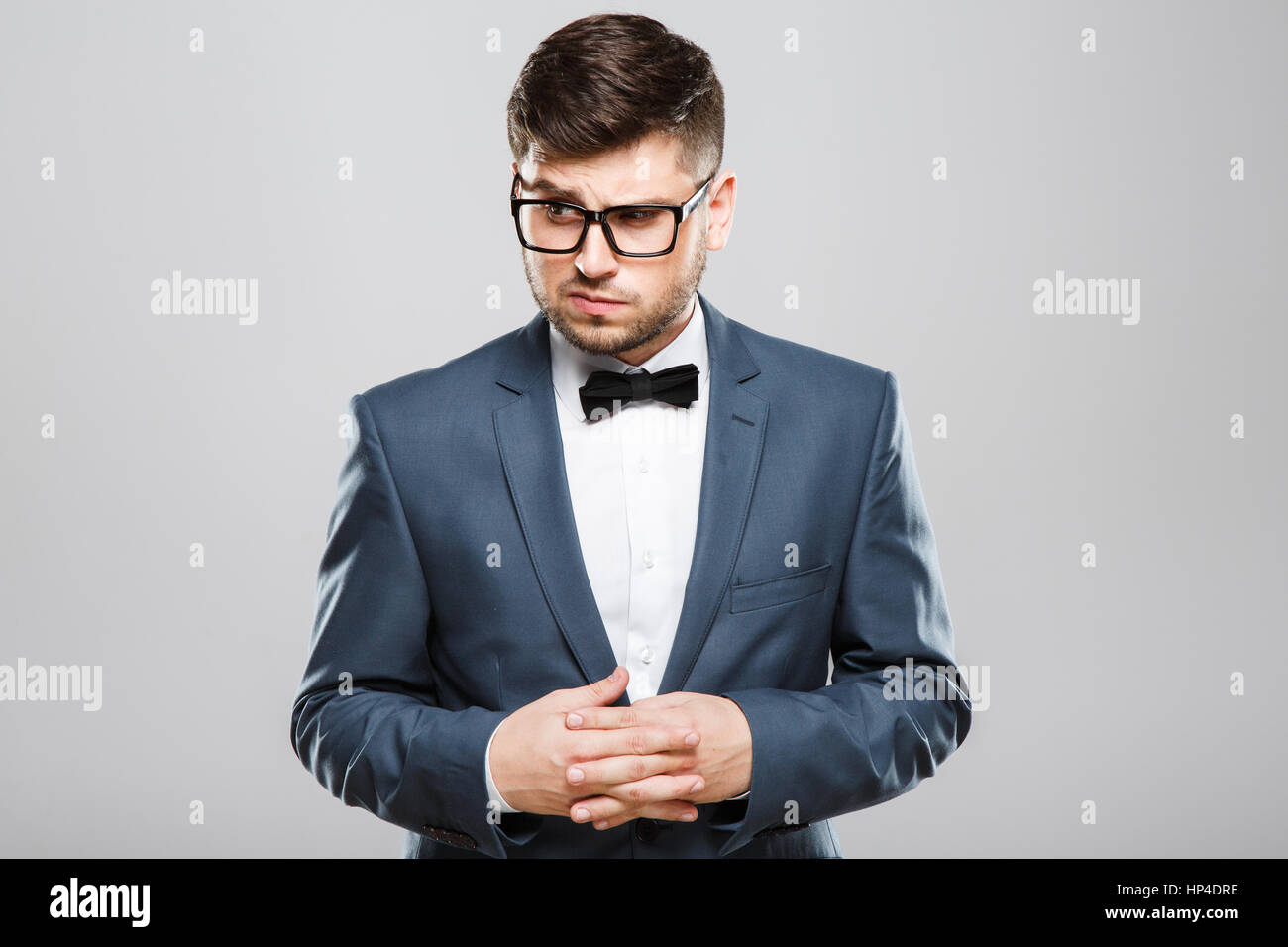Young man looking with contempt Stock Photo - Alamy