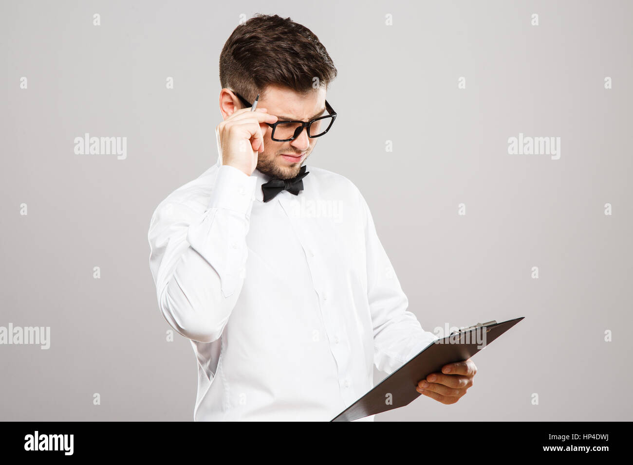 Portrait of handsome man at gray background Stock Photo - Alamy