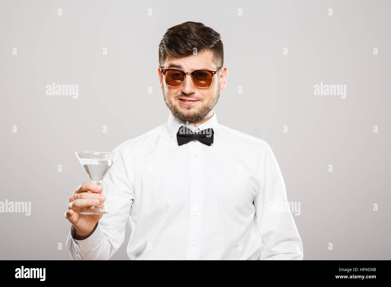 Portrait of handsome man at gray background Stock Photo - Alamy