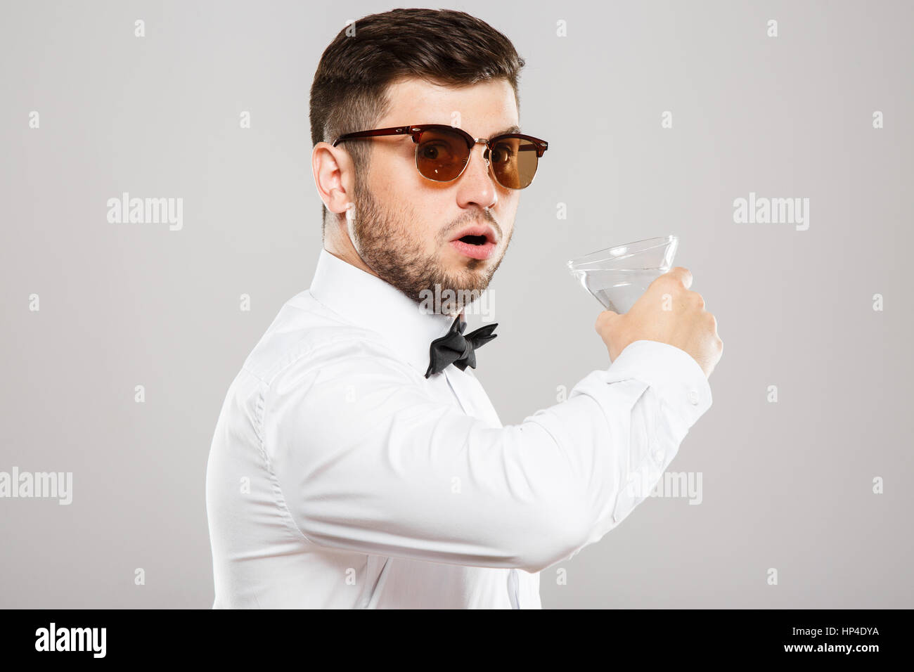 Portrait of handsome man at gray background Stock Photo - Alamy