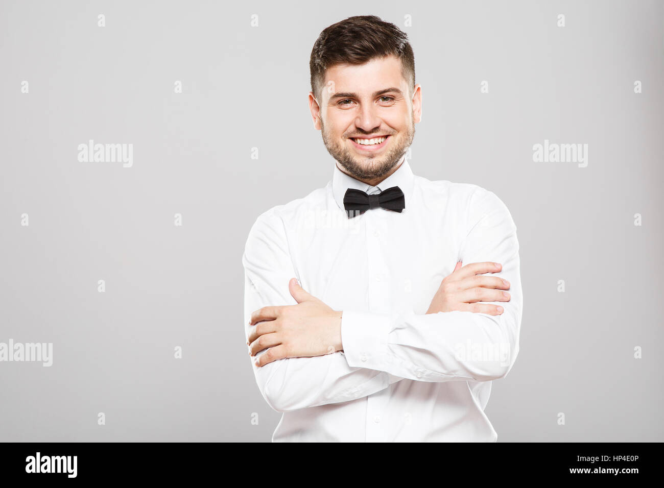 Portrait of handsome man at gray background Stock Photo - Alamy