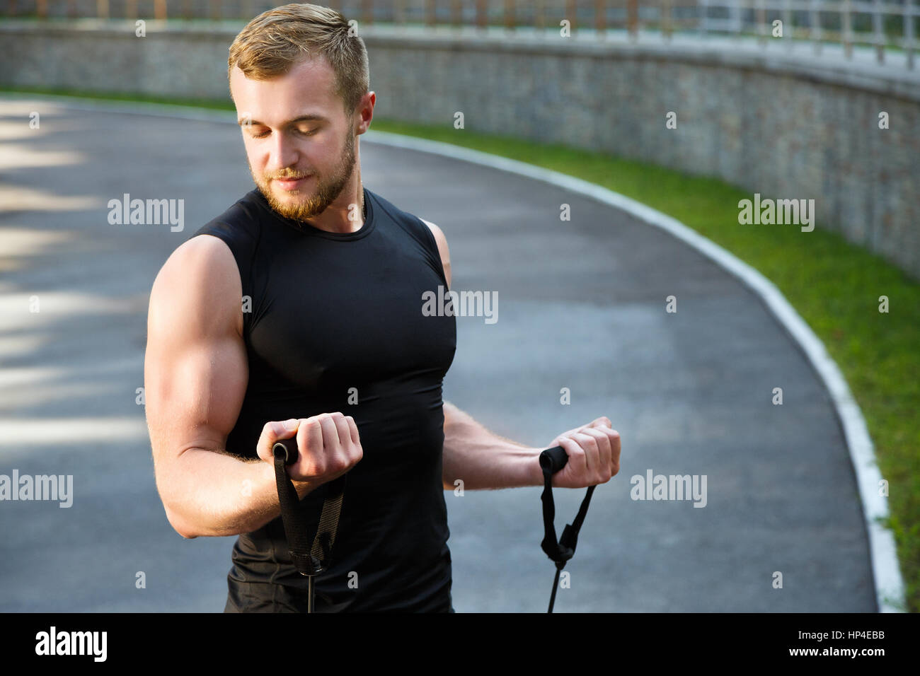 Young man exercising expander hi-res stock photography and images - Alamy