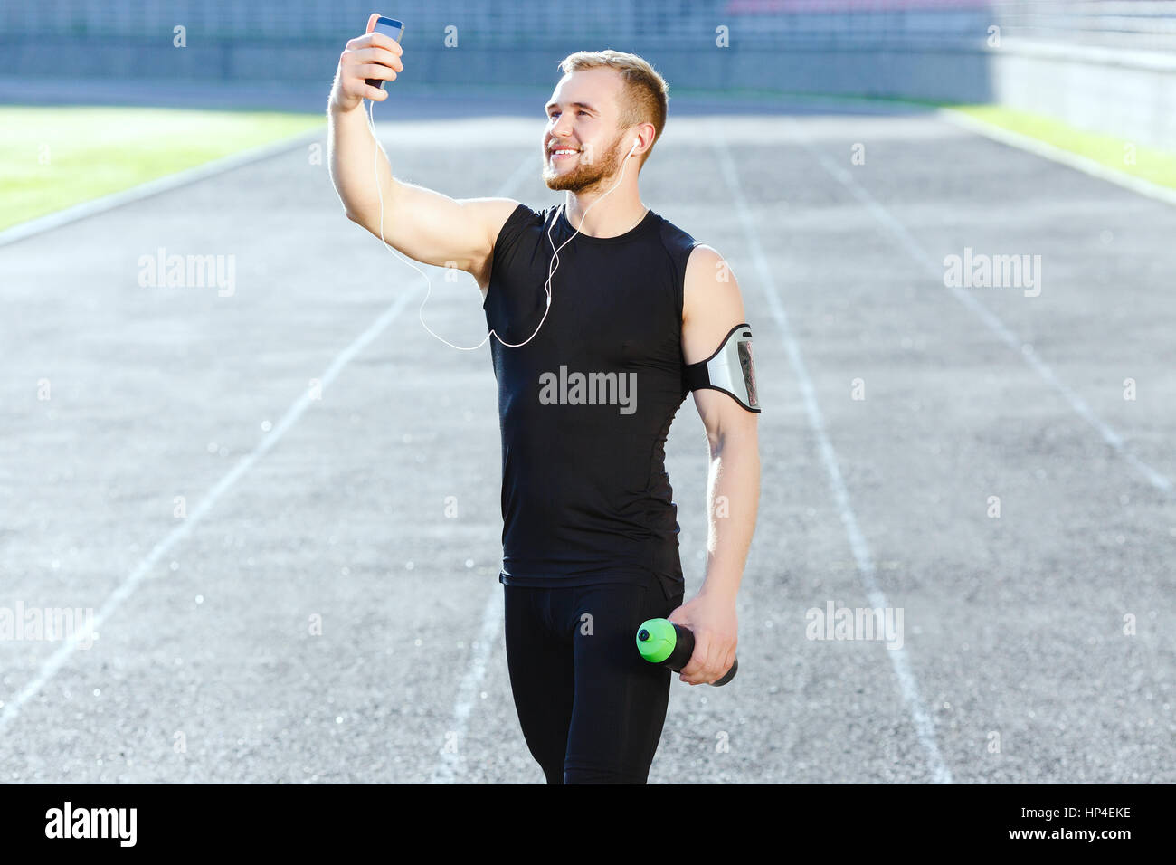 Man making selfie on running track Stock Photo - Alamy