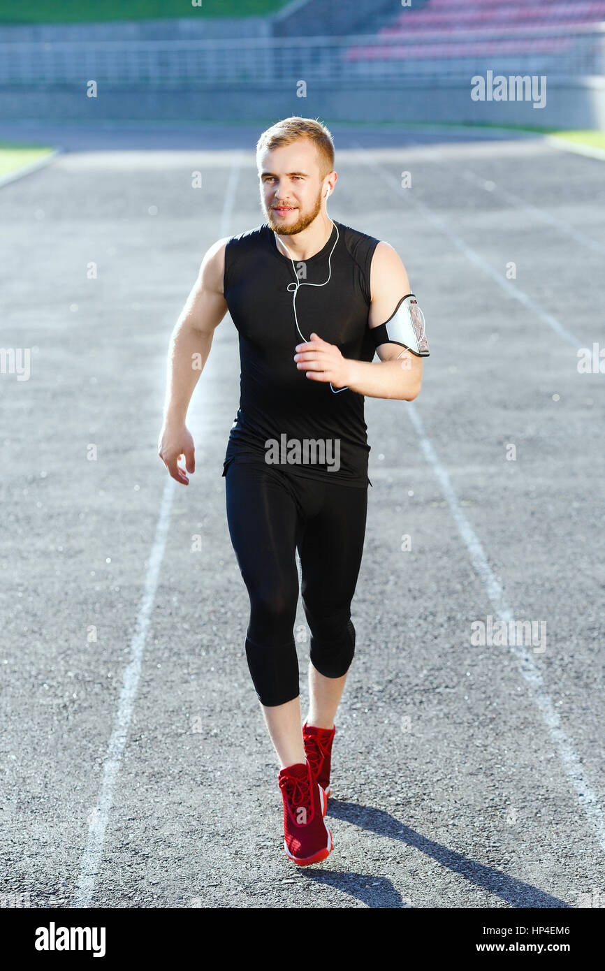 Man running on track Stock Photo - Alamy