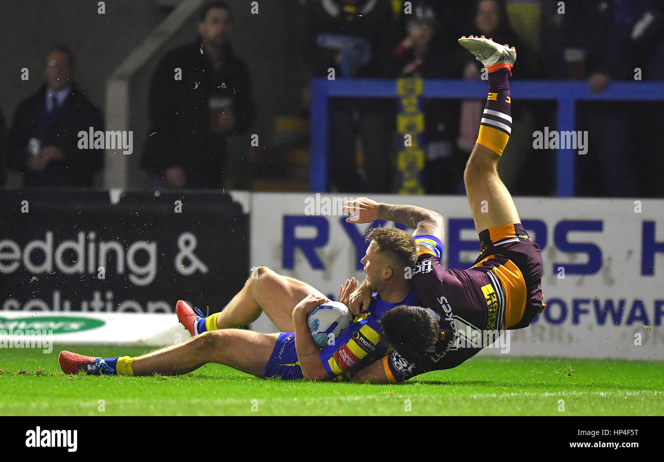 Warrington Wolves' Joe Westerman is tackled by Brisbane Broncos' Ben ...