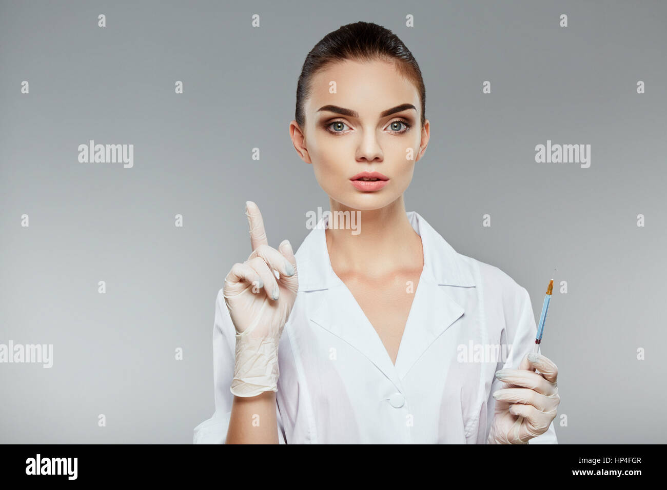 Beautiful nurse in white medical robe Stock Photo - Alamy
