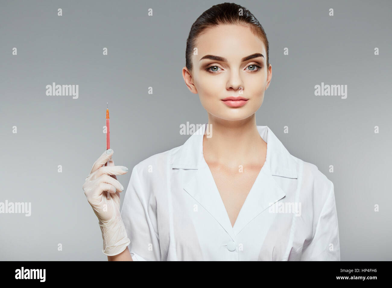 Beautiful nurse in white medical robe Stock Photo - Alamy