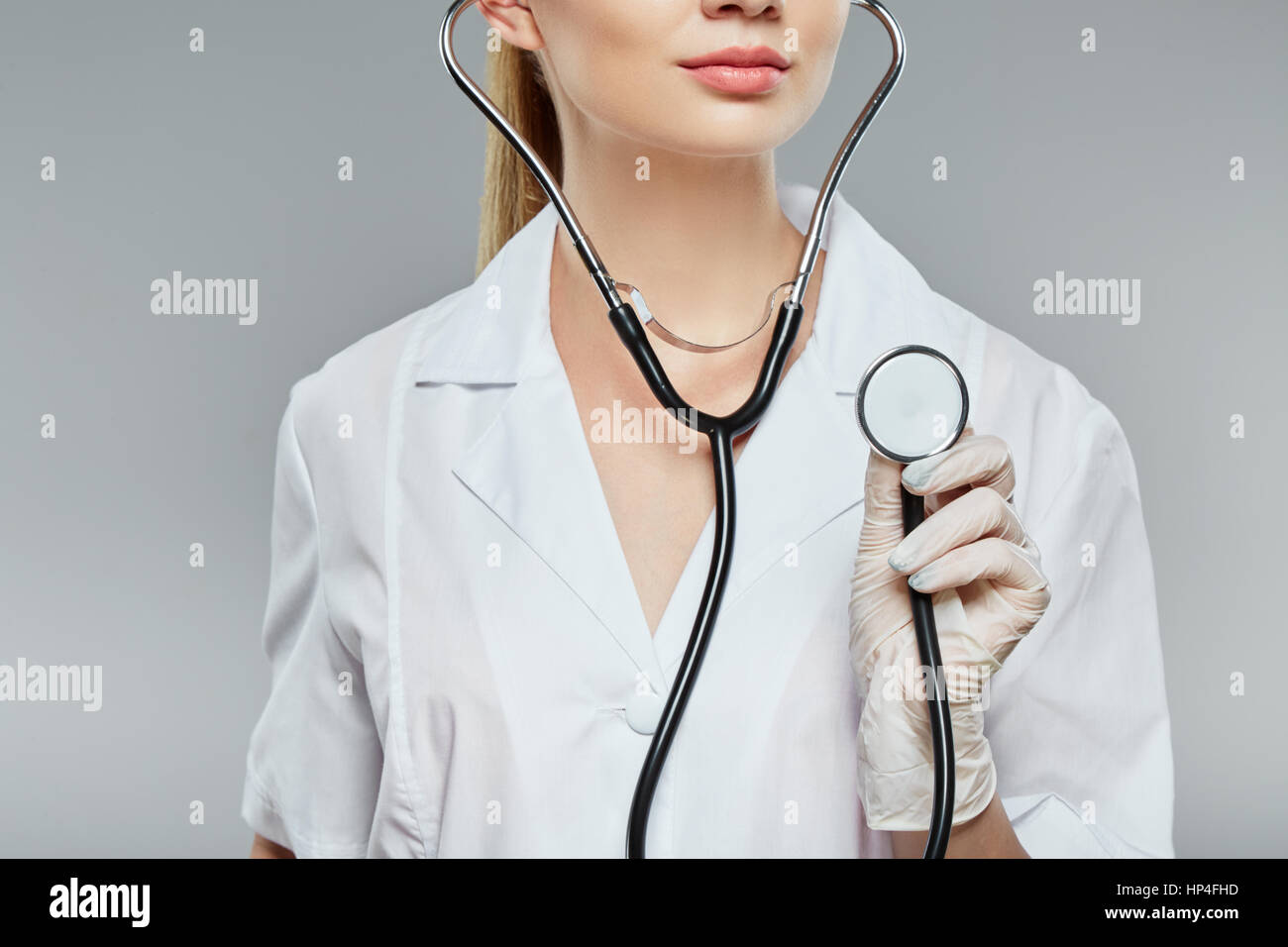 Beautiful nurse in white medical robe Stock Photo - Alamy